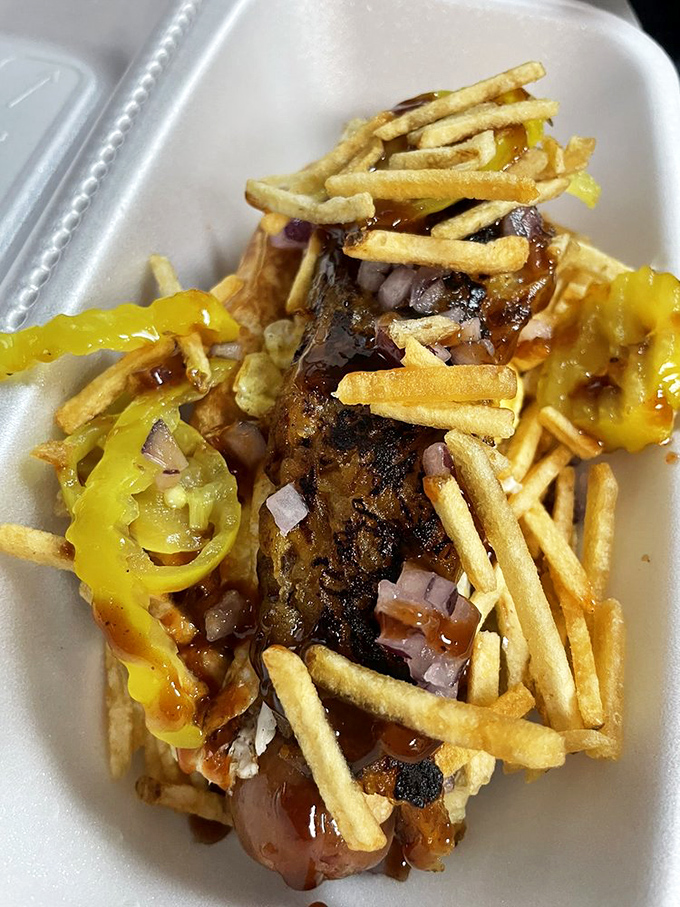 Banana peppers and crispy fries join forces atop this dog, creating a texture party that your mouth definitely wants an invitation to.
