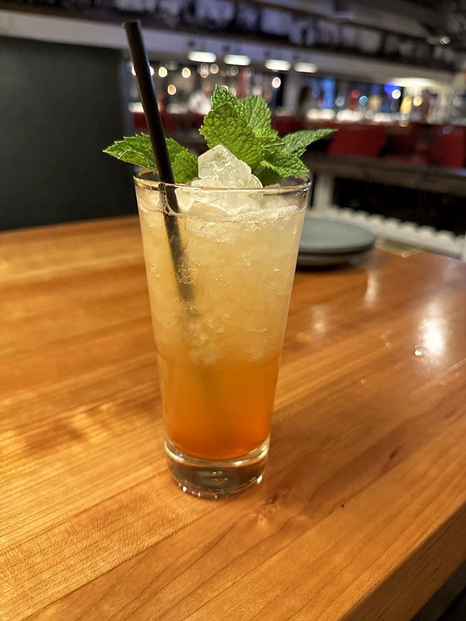 This isn't just a cocktail&mdash;it's a refreshing escape from the Arizona heat, complete with mint leaves standing guard.