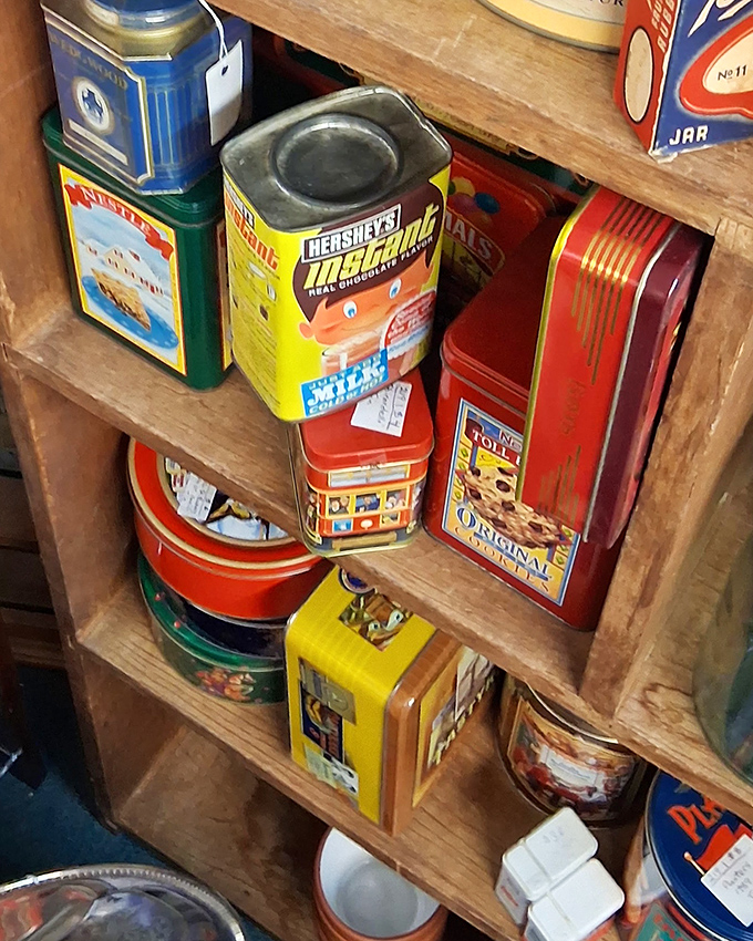 Vintage tins that once held cookies and candies now hold memories. Each dent and scratch tells a story of kitchens past.