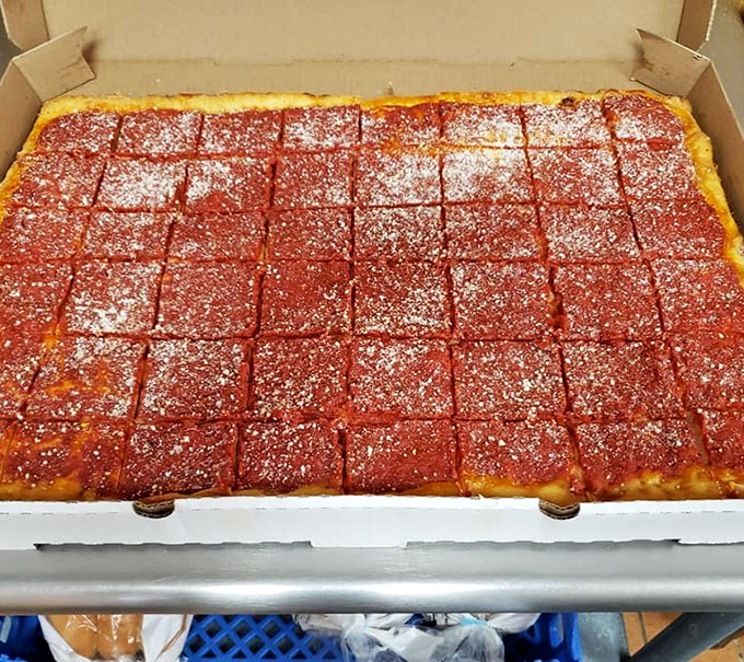 Square slices of tomato pie waiting to be devoured &ndash; Pennsylvania's answer to pizza that makes you question why you'd eat it any other way.