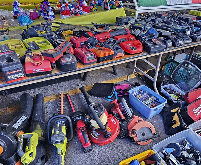 Tool paradise for DIY enthusiasts and professionals alike—power chargers lined up like soldiers ready for weekend warrior home improvement battles.
