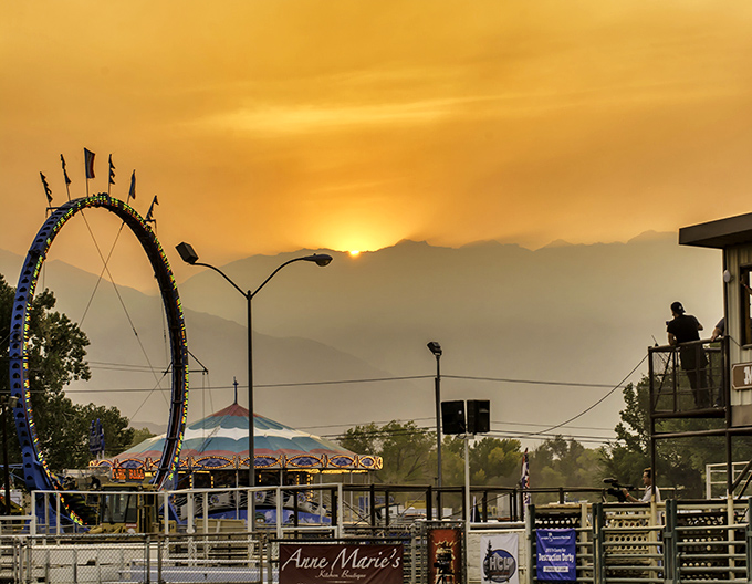 As the sun sets behind the Sierra Nevada, Bishop's fairgrounds transform into a magical twilight playground where memories are made against a golden mountain canvas.