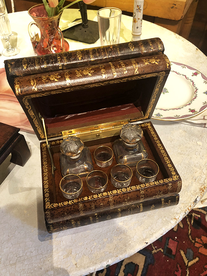 Hiding booze in a book? Genius meets craftsmanship in this trompe l'oeil liqueur cabinet that would make Prohibition-era socialites swoon with delight.