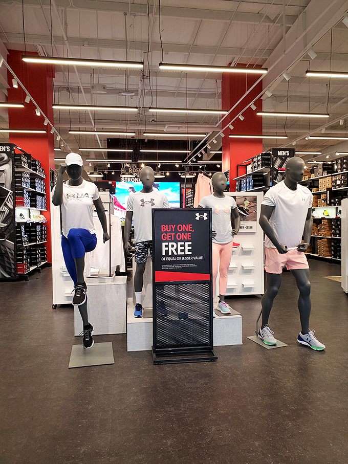 Under Armour's sleek display showcases athletic wear at prices that won't make you sweat. The "buy one, get one" sign is music to a bargain hunter's ears.