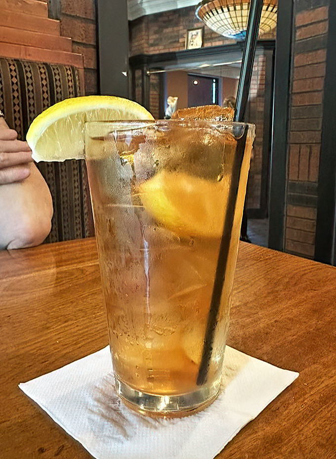 Sometimes the simplest pleasures are the best&mdash;like this perfectly brewed iced tea with a lemon wedge, ready to wash down all that savory goodness.