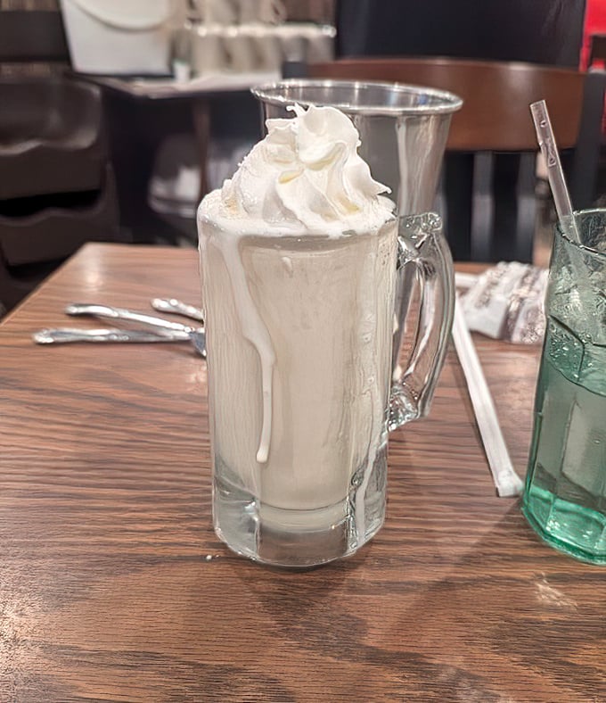 A vanilla milkshake so thick you'll need both a straw and a spoon. The whipped cream crown makes this glass a dessert kingdom worth conquering.