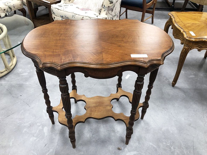 This isn't just a vintage side table; it's the supporting character your living room needs for its design redemption story.