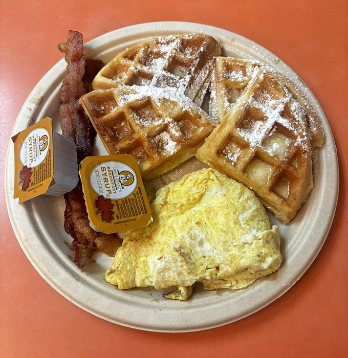 Waffles dusted with powdered sugar, eggs cooked just right, and bacon that's achieved that mythical balance between crisp and chewy.