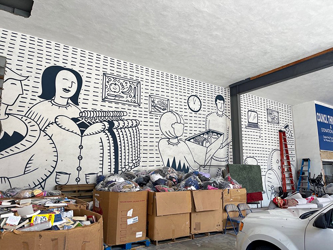 The store's whimsical wall mural transforms the donation area into an art space, proving secondhand doesn't mean second-rate aesthetics.