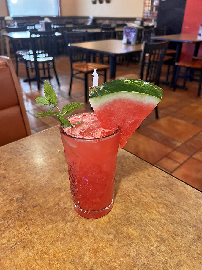 Summer in a glass! This watermelon mojito, garnished with a slice of the real deal, might just make you forget you're in Pennsylvania and not on a Mediterranean beach.