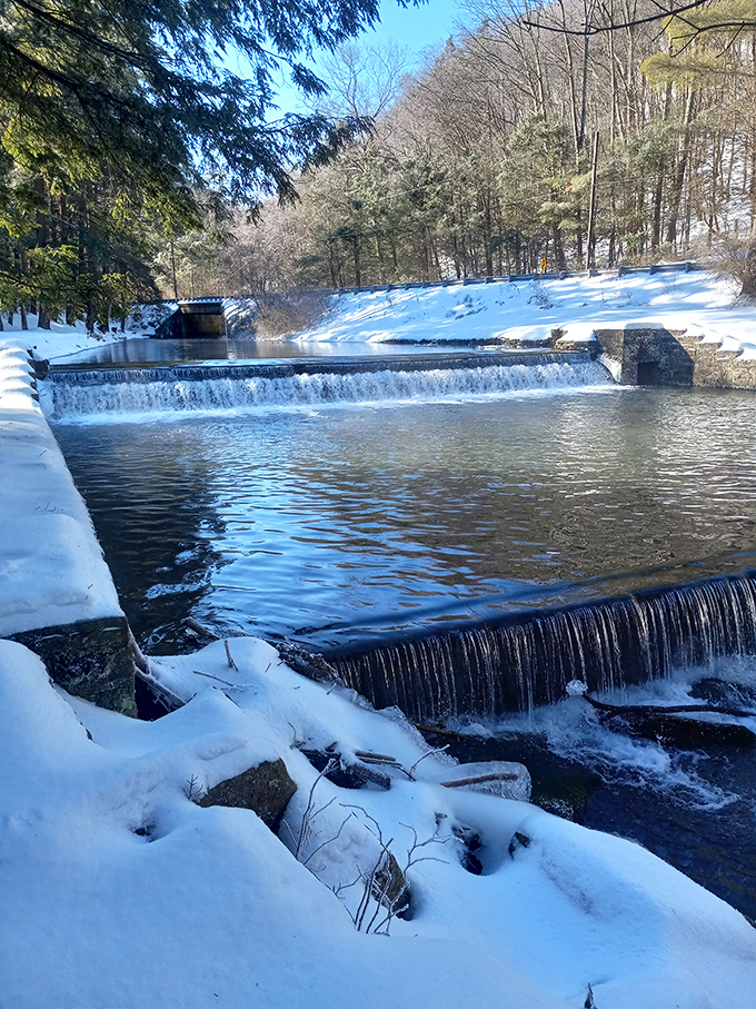 Winter transforms the dam into a snow-framed masterpiece. Even in freezing temperatures, this view somehow warms the soul.