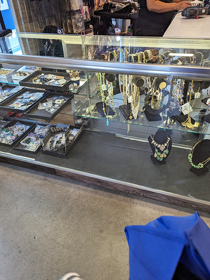 Behind glass lurks a jewelry case democracy where costume pieces mingle freely with potential hidden gems.