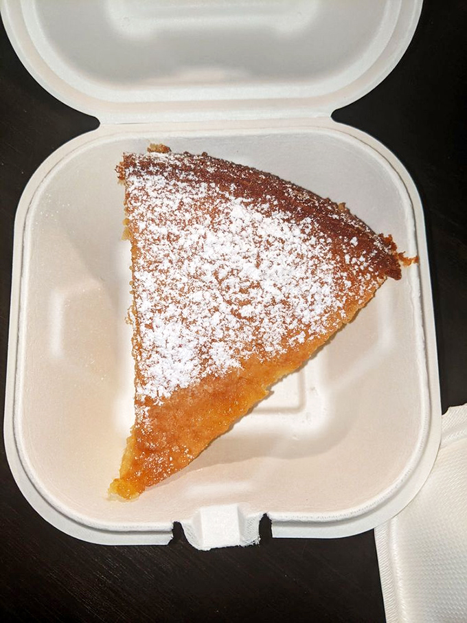 A slice of almond cake that somehow manages to be both delicate and substantial—the breakfast dessert you'll absolutely justify having.