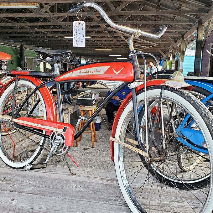 This vintage bicycle isn't just transportation; it's a time machine on wheels, its cherry-red finish still gleaming with mid-century optimism.