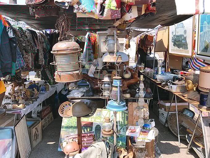 Organized chaos of nostalgia &ndash; where maritime lamps, Buddha statues, and forgotten treasures create a three-dimensional time capsule under canvas.