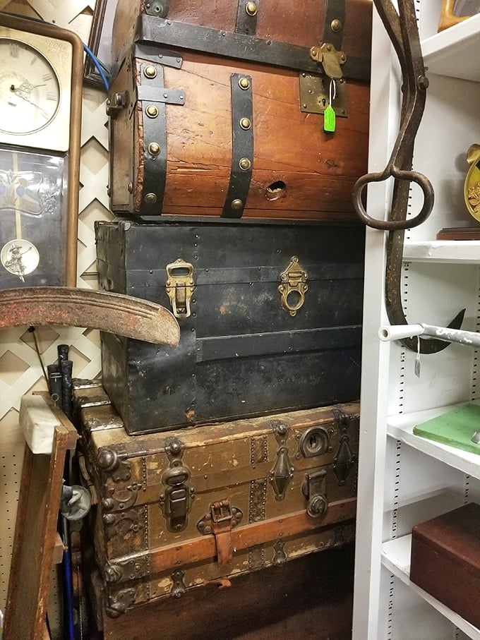 Stacked like a traveler's timeline, these weathered trunks once carried someone's entire world across oceans and continents before landing here. 