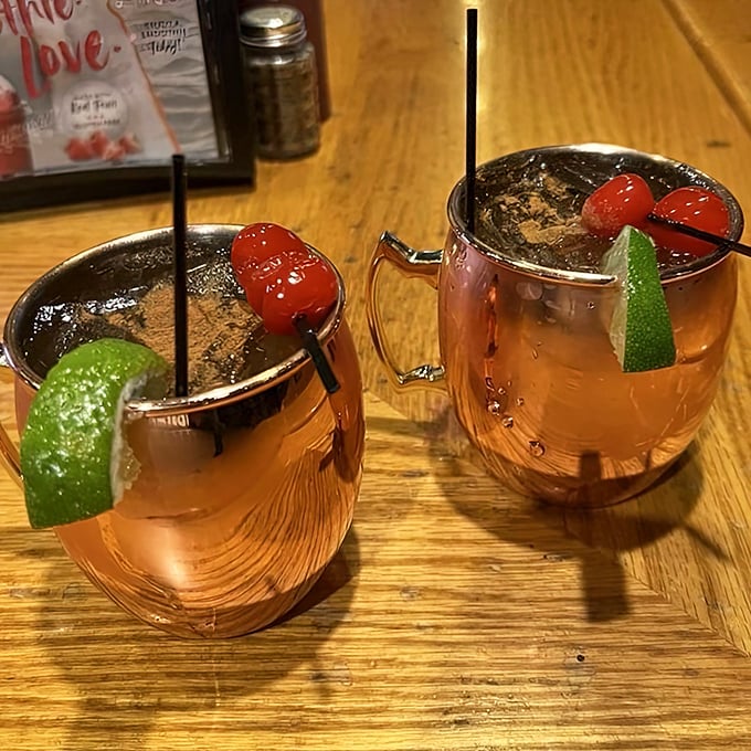 Moscow Mules with a Wisconsin twist&mdash;copper mugs gleaming with promise, garnished with cherries that whisper, "This isn't your standard cocktail."