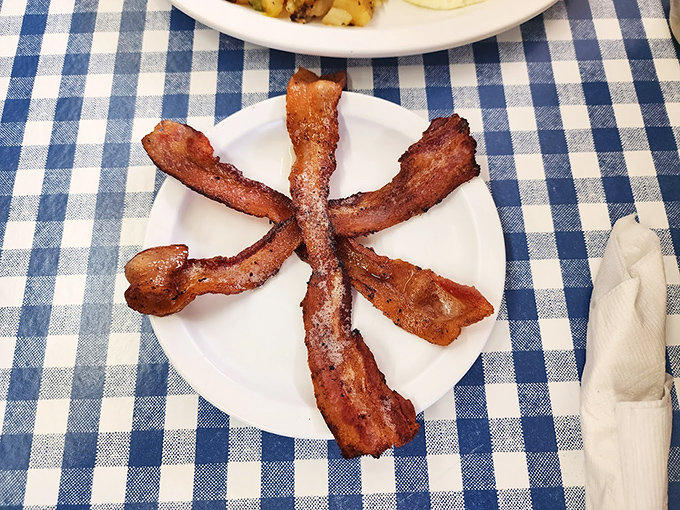 Bacon artfully arranged like a sunburst on white porcelain&mdash;a reminder that some pleasures remain blissfully uncomplicated and immune to foodie reinvention.