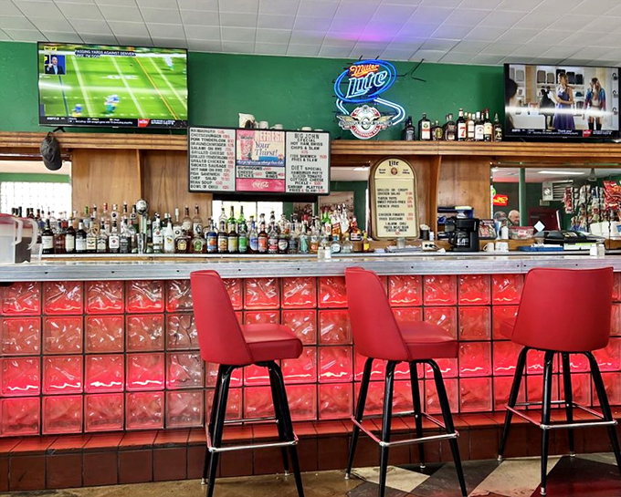 The bar area glows with neon signs and red glass blocks&mdash;a time capsule where cold drinks and warm conversation have flowed for generations.