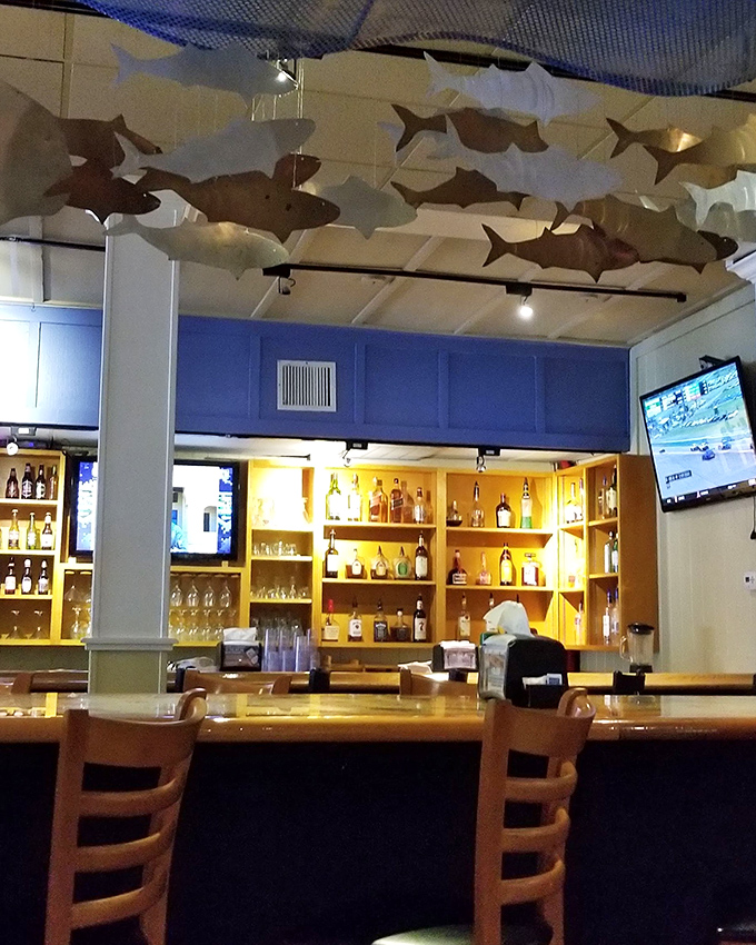 The bar area, complete with fish swimming overhead, makes waiting for a table feel less like waiting and more like pre-gaming.