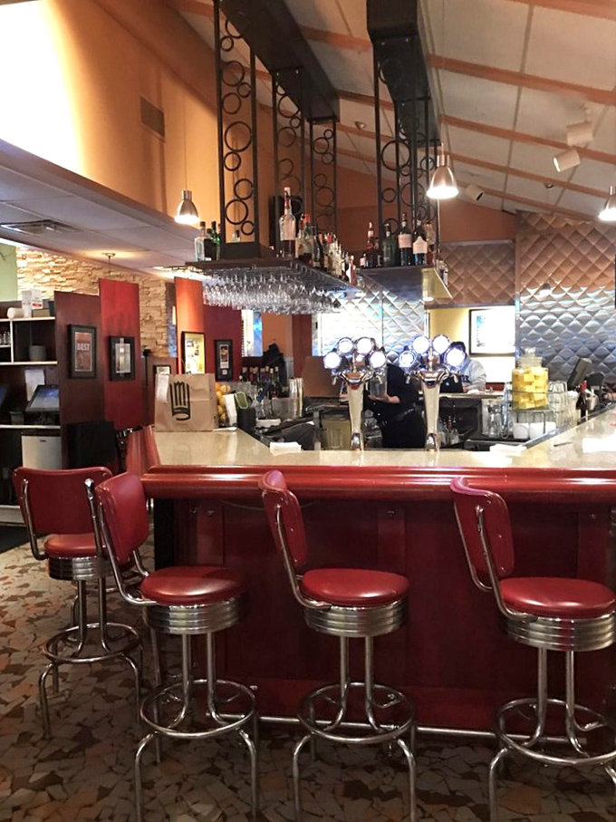 The bar area&mdash;where classic cocktails meet modern mixology under the watchful gaze of vintage-inspired decor. Cheers to that!