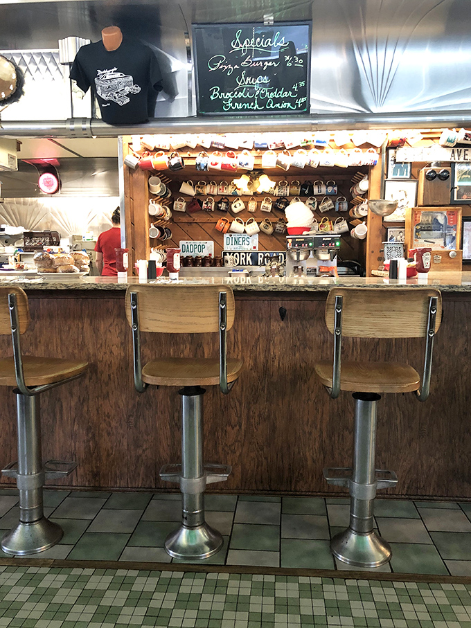 The counter where breakfast magic happens. Those stools have witnessed countless coffee refills and life-changing breakfast decisions.