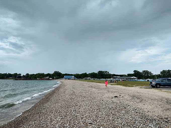 Storm clouds gather but can't diminish the beach's allure. That distinctive pebble-sand gradient is Mother Nature's signature design element. 