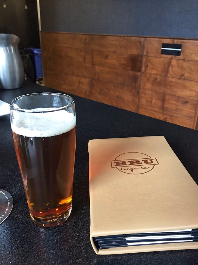 A perfectly poured craft beer alongside the leather-bound menu&mdash;a pairing as classic as Bogart and Bacall.