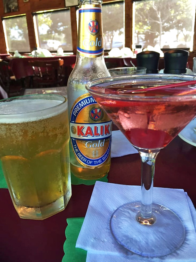 Island vibes in liquid form: a cold Kalik beer and a perfectly mixed cocktail&mdash;because boat rides and good food deserve proper liquid accompaniments.