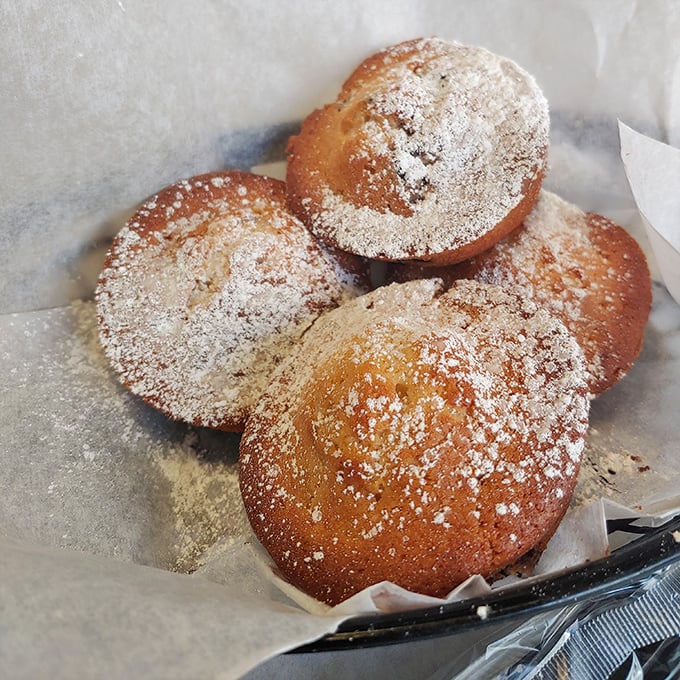 These powdered sugar-dusted muffins aren't just baked goods—they're edible pillows of joy that make Monday mornings bearable again.