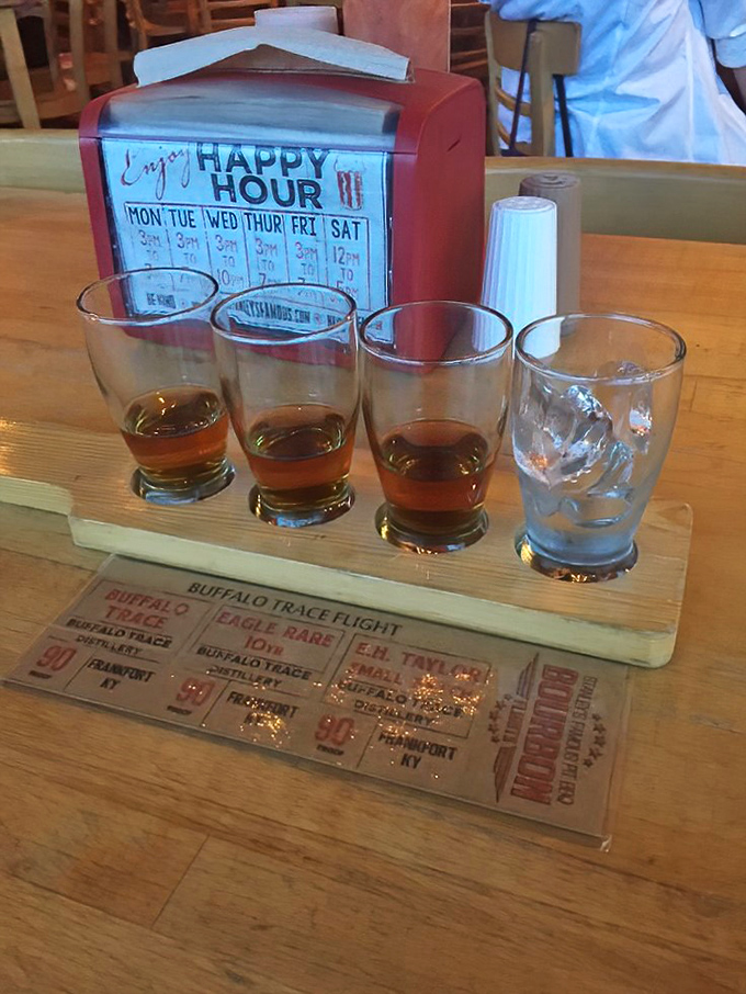 Bourbon flights: where education meets relaxation. This wooden board of amber goodness is basically a PhD in Kentucky's finest export.