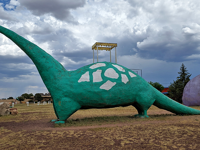 This turquoise brachiosaurus isn't just prehistoric eye candy &ndash; climb to the top for a slide that's sure to awaken your inner child.