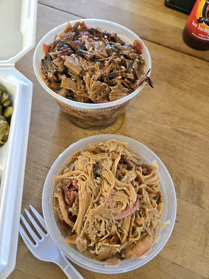 Double trouble in the best way possible. Containers of brisket and pulled pork ready to transport you to a higher plane of barbecue consciousness.