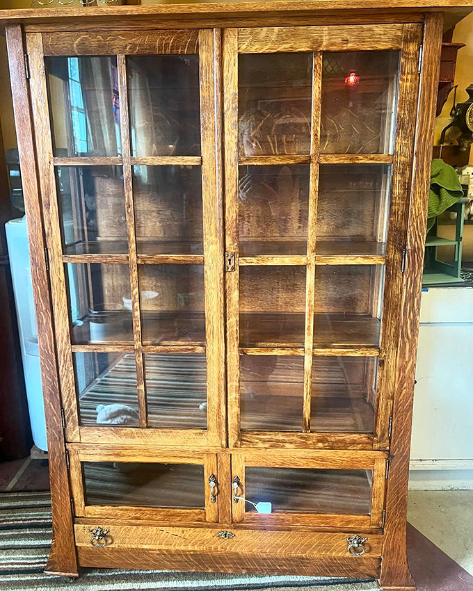 An oak display cabinet with the kind of craftsmanship that makes modern furniture weep. They literally don't make them like this anymore&mdash;and your IKEA knows it.