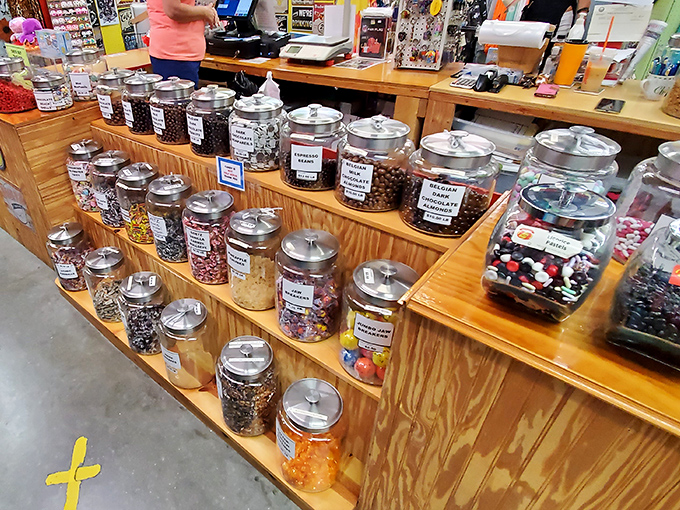 Candy jars lined up like soldiers in a sugar army. The battlefield where diets go to surrender and childhood memories come flooding back.
