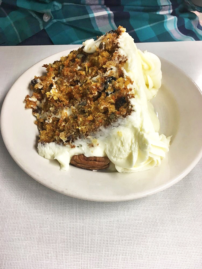 Carrot cake that looks like it could win a beauty pageant and solve world peace, all while delivering that perfect cream cheese frosting-to-cake ratio.