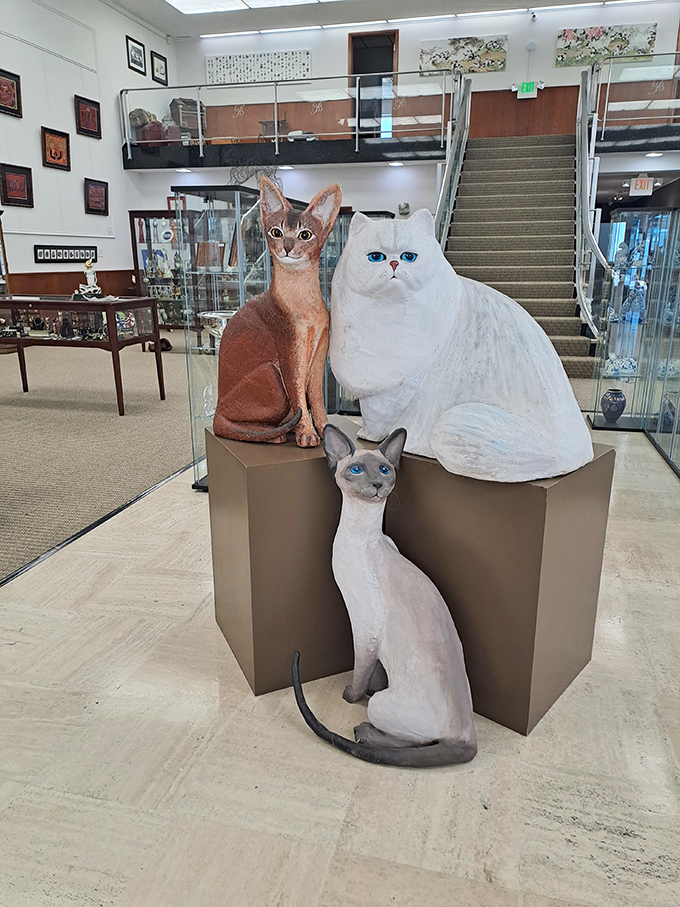 Life-sized breed sculptures give visitors a chance to admire perfect feline specimens that never demand treats or knock things off shelves.
