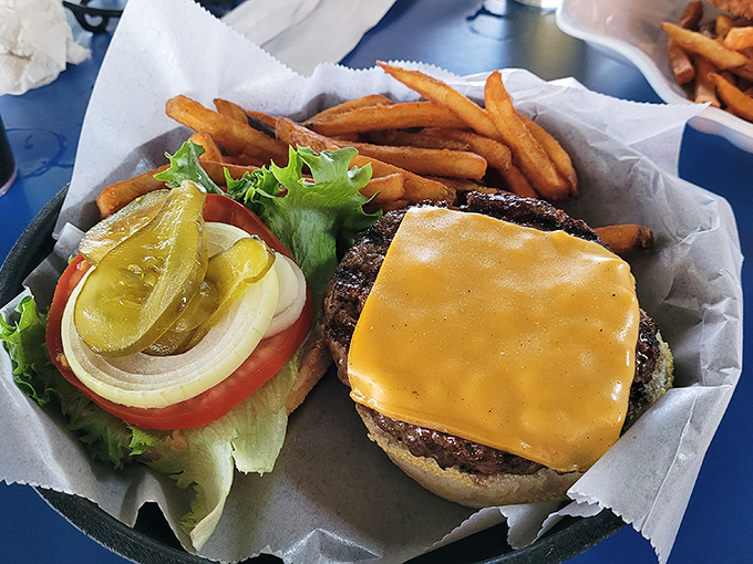 This isn't just a cheeseburger; it's the reason napkins were invented. Notice how the cheese melts just right&mdash;that's not an accident, folks.