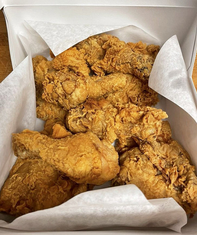 Fried chicken that makes Colonel Sanders nervous. Golden, craggly crust protecting juicy meat beneath&mdash;the kind worth driving across town for.