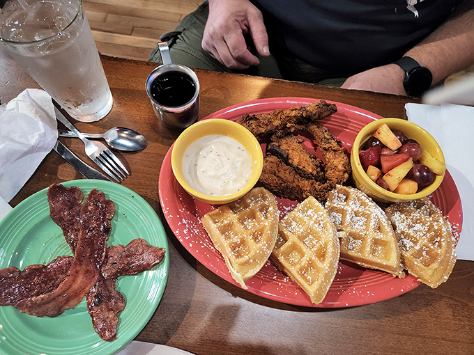 Chicken and waffles: breakfast's most harmonious odd couple. Sweet, savory, and served with real maple syrup that's worth the sticky fingers.