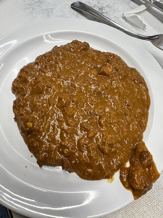 The legendary chili&mdash;beanless, meaty, and perfectly spiced. This isn't just a topping; it's the cornerstone of Detroit's coney culture. 