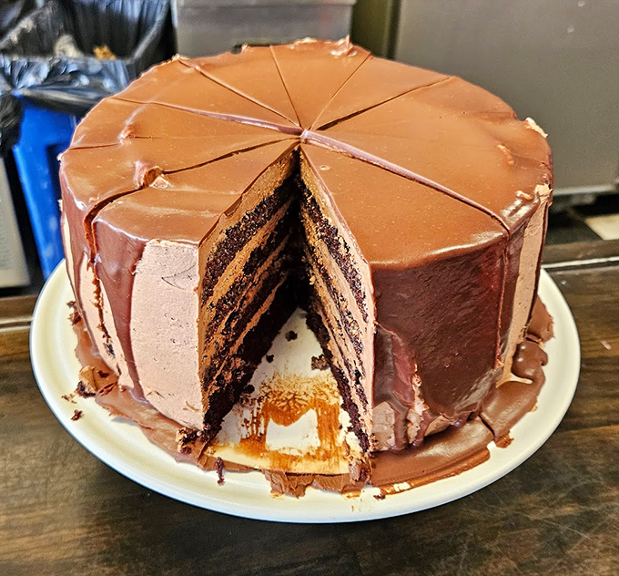 This chocolate layer cake isn't trying to reinvent dessert&mdash;it's reminding you why classics became classics. Each perfect slice represents the PhD of diner desserts.