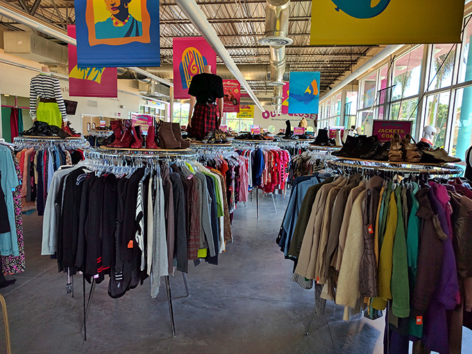 Clothing racks stretch toward the horizon, organized by type and size. The rainbow of fabrics contains hidden designer gems for the eagle-eyed fashionista.