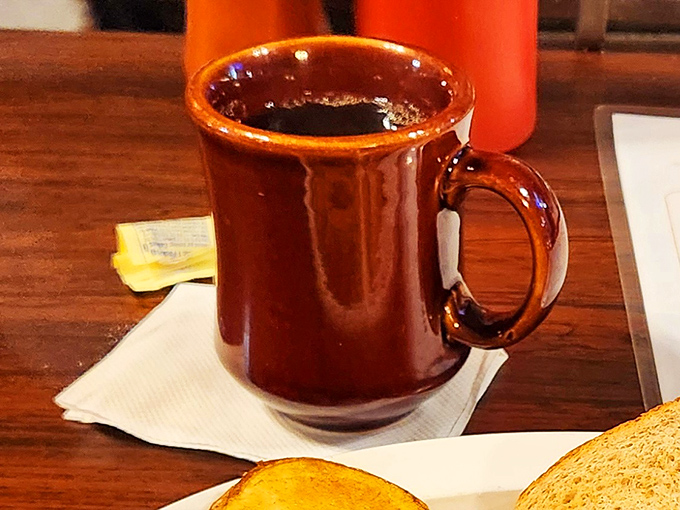 That classic brown diner mug holds liquid comfort that pairs perfectly with good conversation and great food.