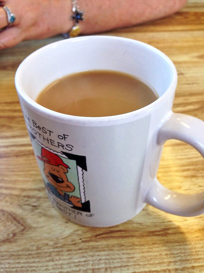 Coffee served in a mug with personality &ndash; because at Early Birds, even your caffeine delivery system comes with a side of charm.