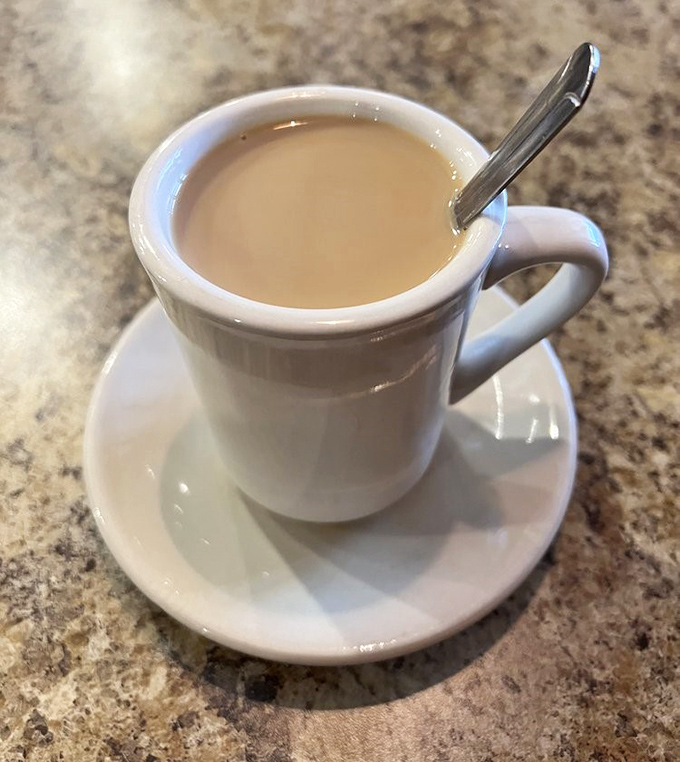 Coffee in a proper diner mug &ndash; the original social network where ideas, gossip, and caffeine flow with equal enthusiasm.