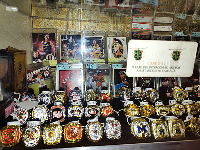 Championship rings and sports memorabilia glitter under glass, each one representing someone's moment of glory, now waiting for a new admirer.