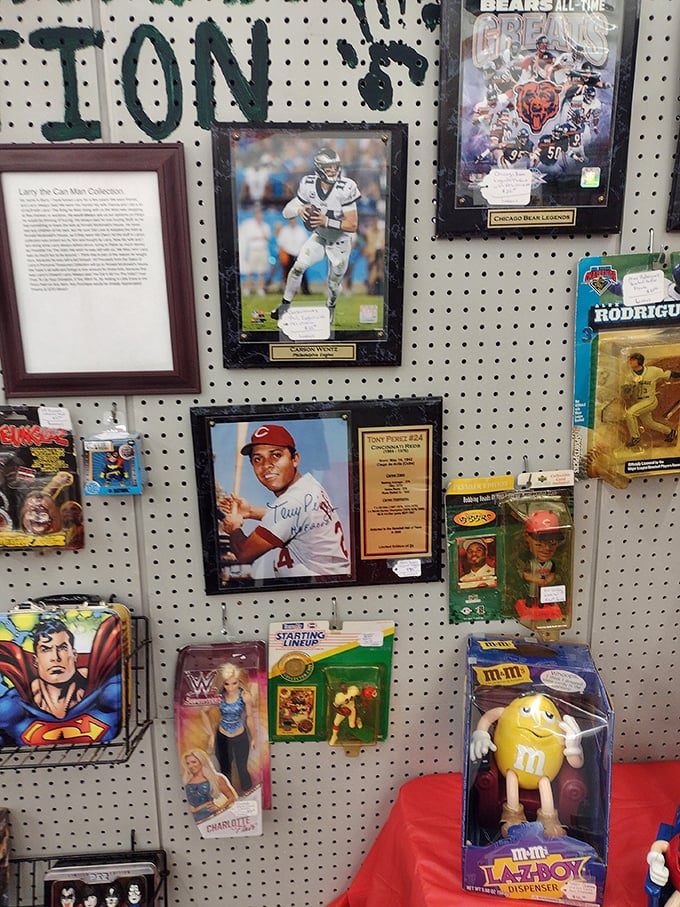 Sports memorabilia that captures frozen moments of greatness. This wall celebrates heroes of the diamond and gridiron, preserved behind glass for fans and collectors alike.