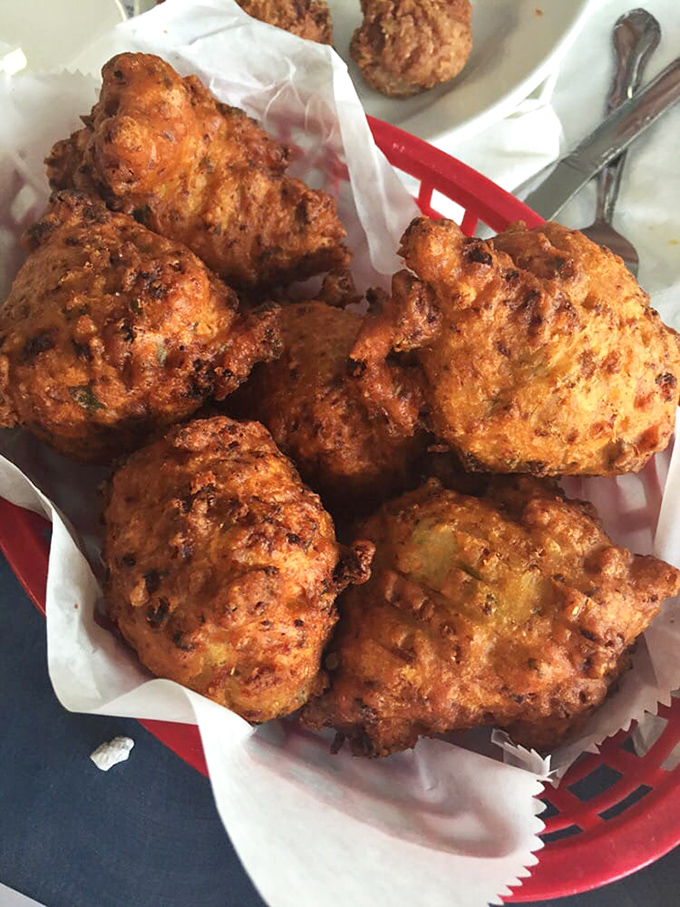 Conch fritters that could make a mermaid swim upstream. Golden-brown spheres of island tradition that crunch then melt in your mouth.