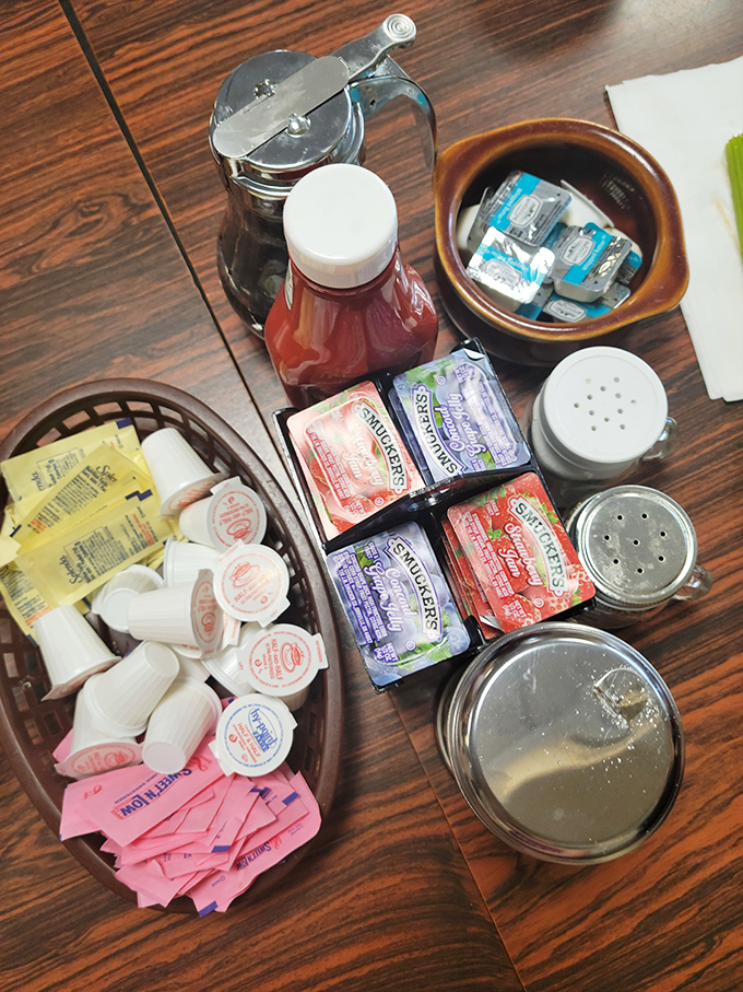 The condiment caddy&mdash;breakfast's unsung hero. Jellies, creamers, and sweeteners standing by to customize your morning masterpiece.